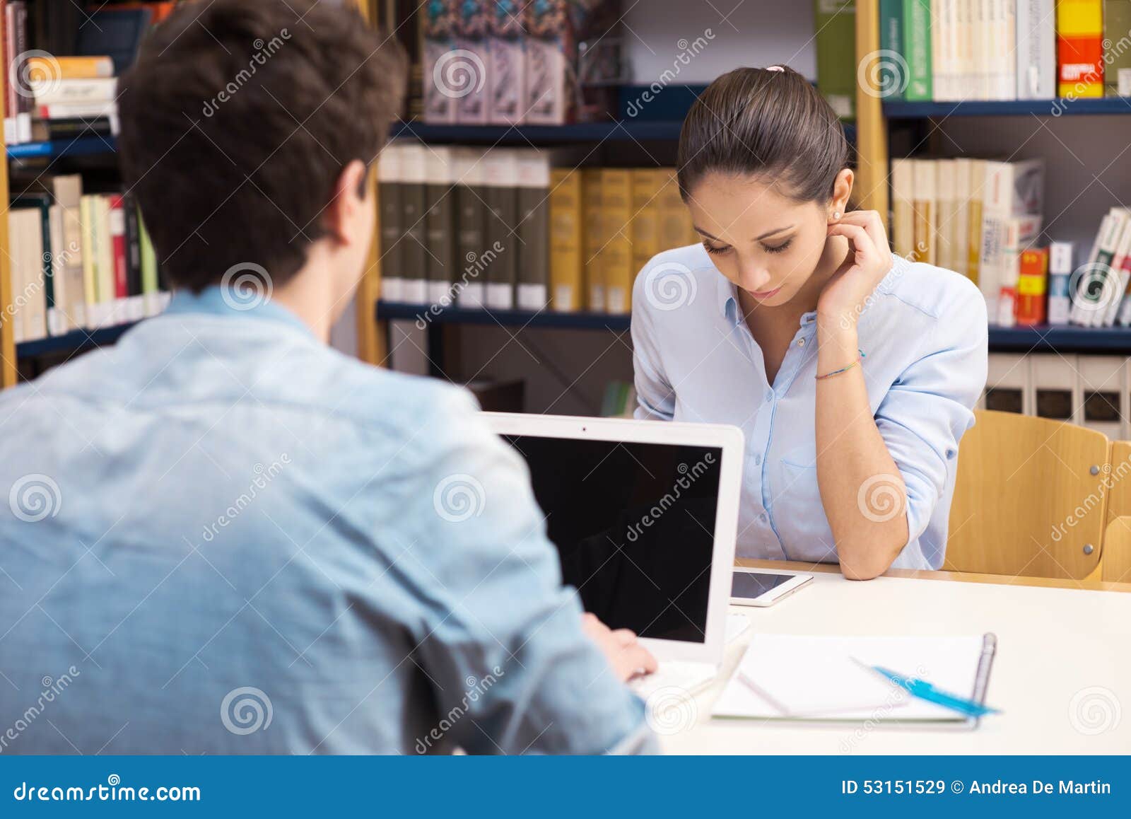 Young students at desk stock image. Image of digital - 53151529