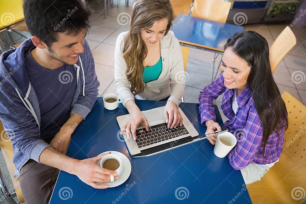 Young Students Doing Assignment on Laptop Together Stock Photo - Image ...