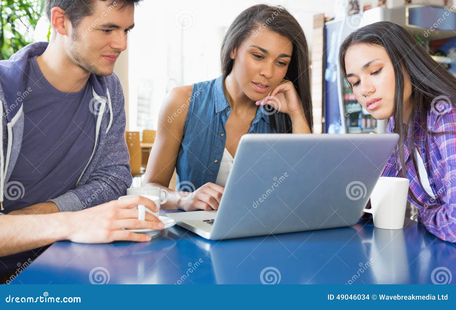 Young Students Doing Assignment on Laptop Together Stock Photo - Image ... Young Students Doing Assignment on Laptop Together Stock Photo - Image ...