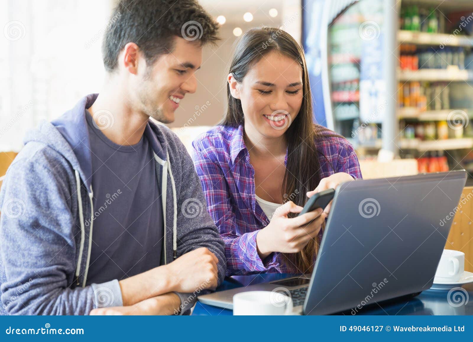 Young Students Doing Assignment on Laptop Together Stock Image - Image ... Young Students Doing Assignment on Laptop Together Stock Image - Image ...
