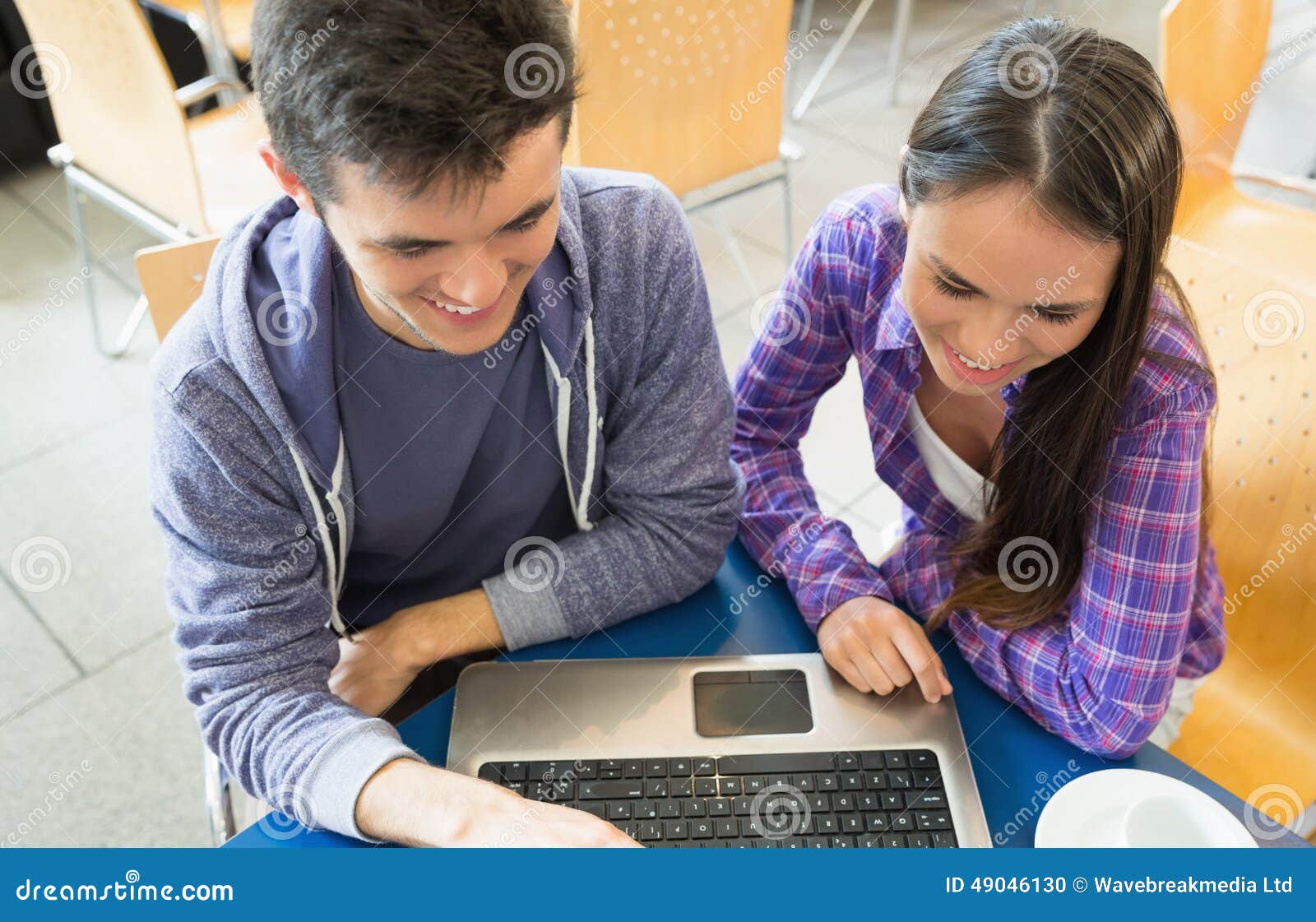 Young Students Doing Assignment on Laptop Together Stock Photo - Image ... Young Students Doing Assignment on Laptop Together Stock Photo - Image ...