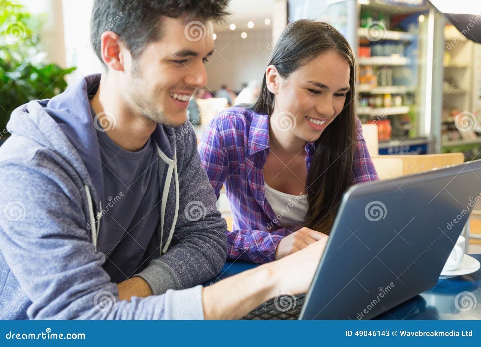 Young Students Doing Assignment on Laptop Together Stock Image - Image ... Young Students Doing Assignment on Laptop Together Stock Image - Image ...