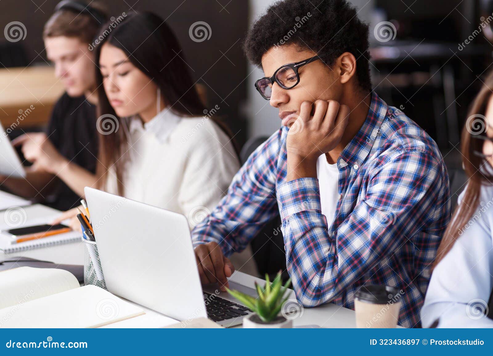 Young Students Engaged in Learning at Classroom during School Hours ...