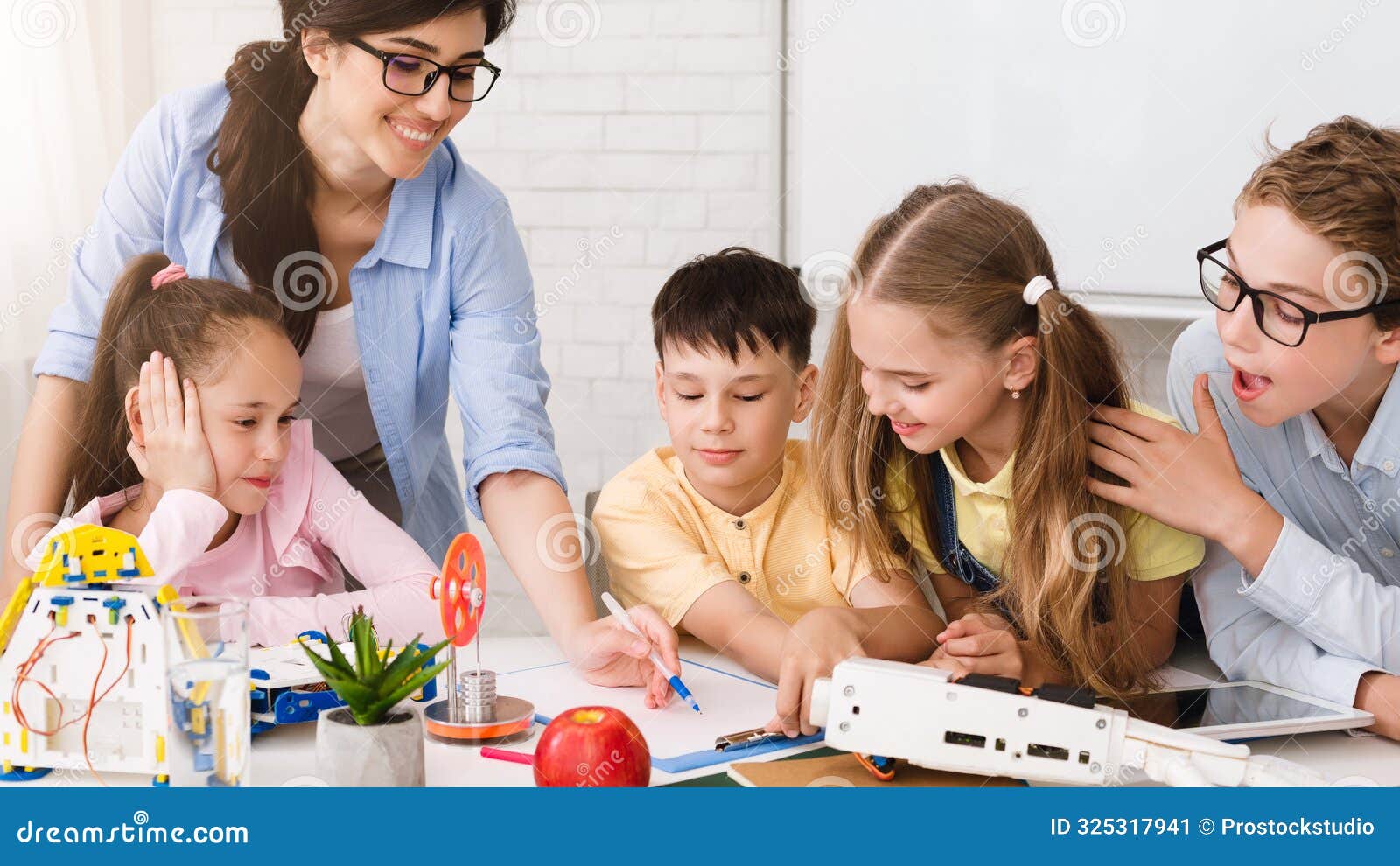 Young Students Learning Robotics and Engineering in a Classroom Setting ...