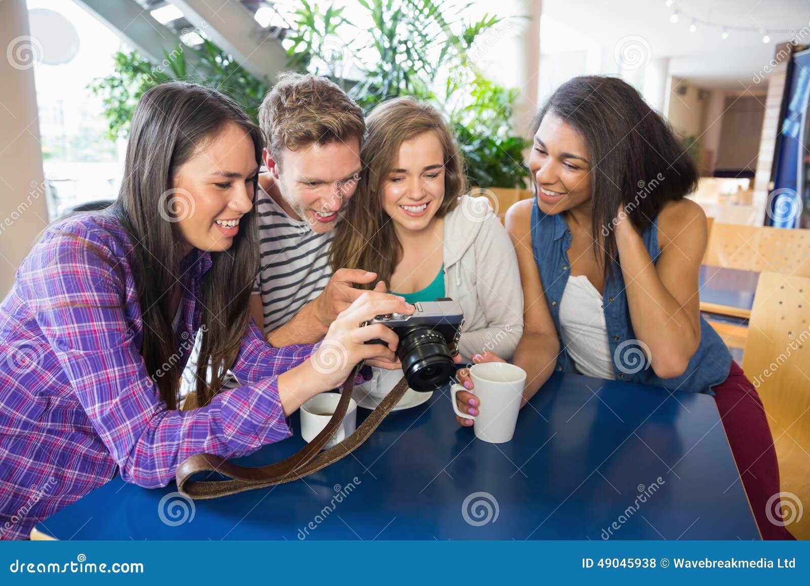 Young Students Looking at a Camera Stock Photo - Image of sitting ...