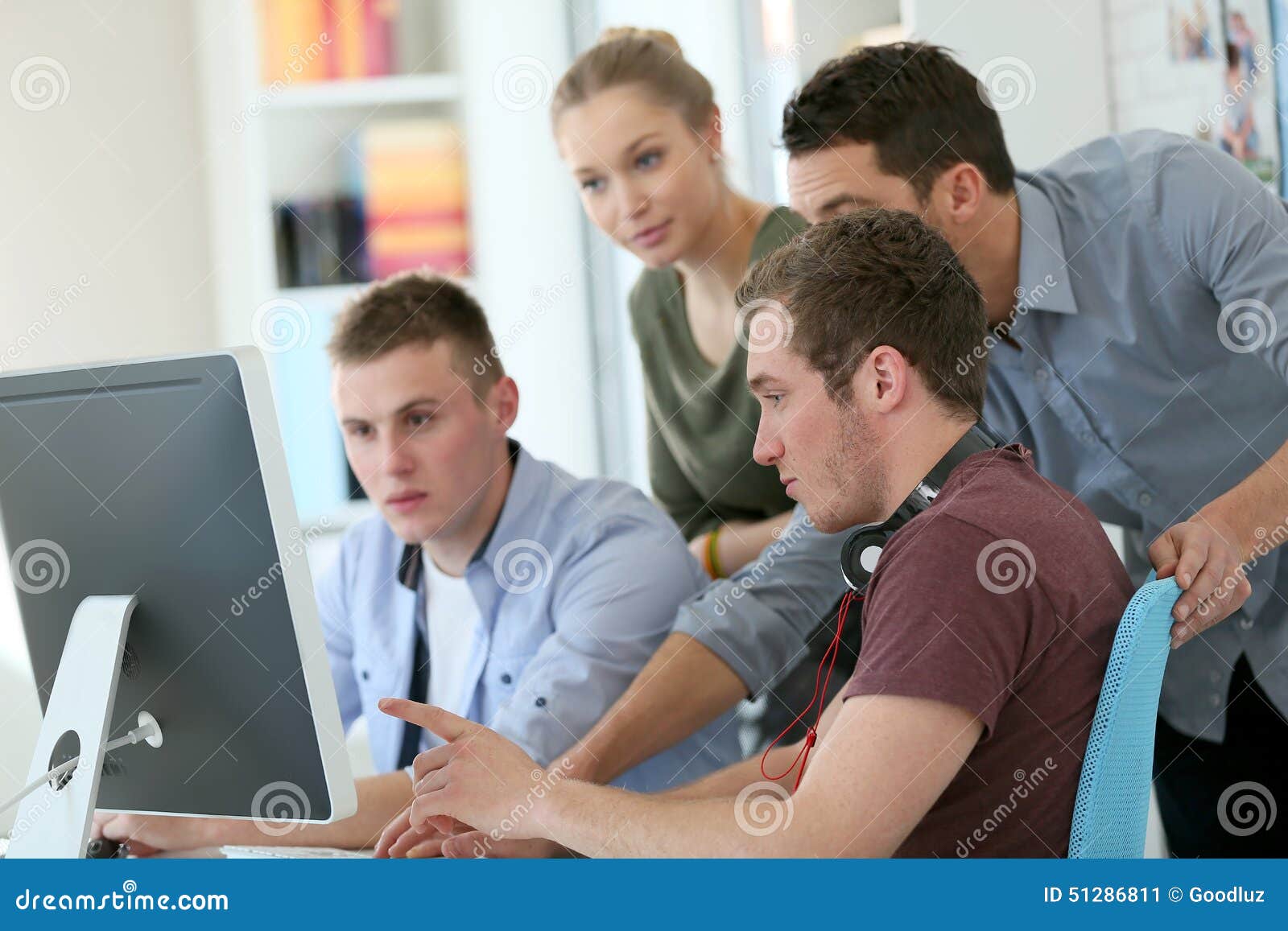 Young Students with Professor Behind the Computer Stock Image - Image ...