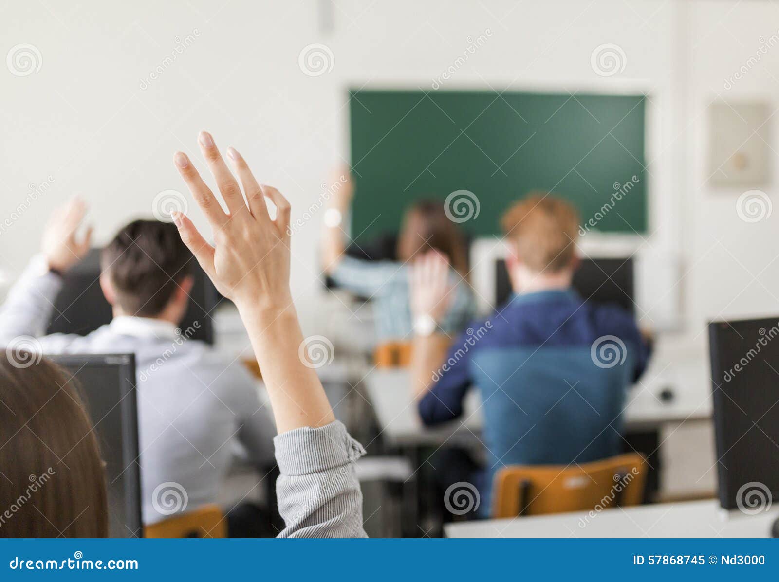Young Students Raising Hands in a Classroom Stock Image - Image of ...