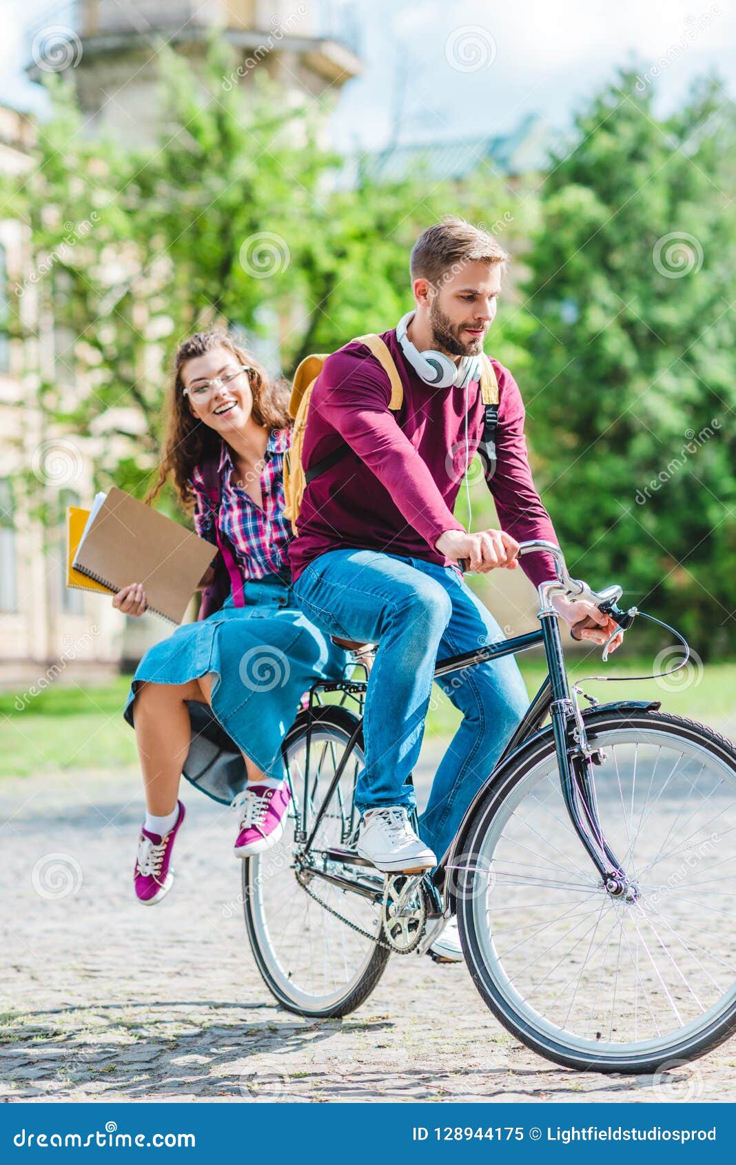 Young Students Riding Bicycle Together Stock Image - Image of bike ...