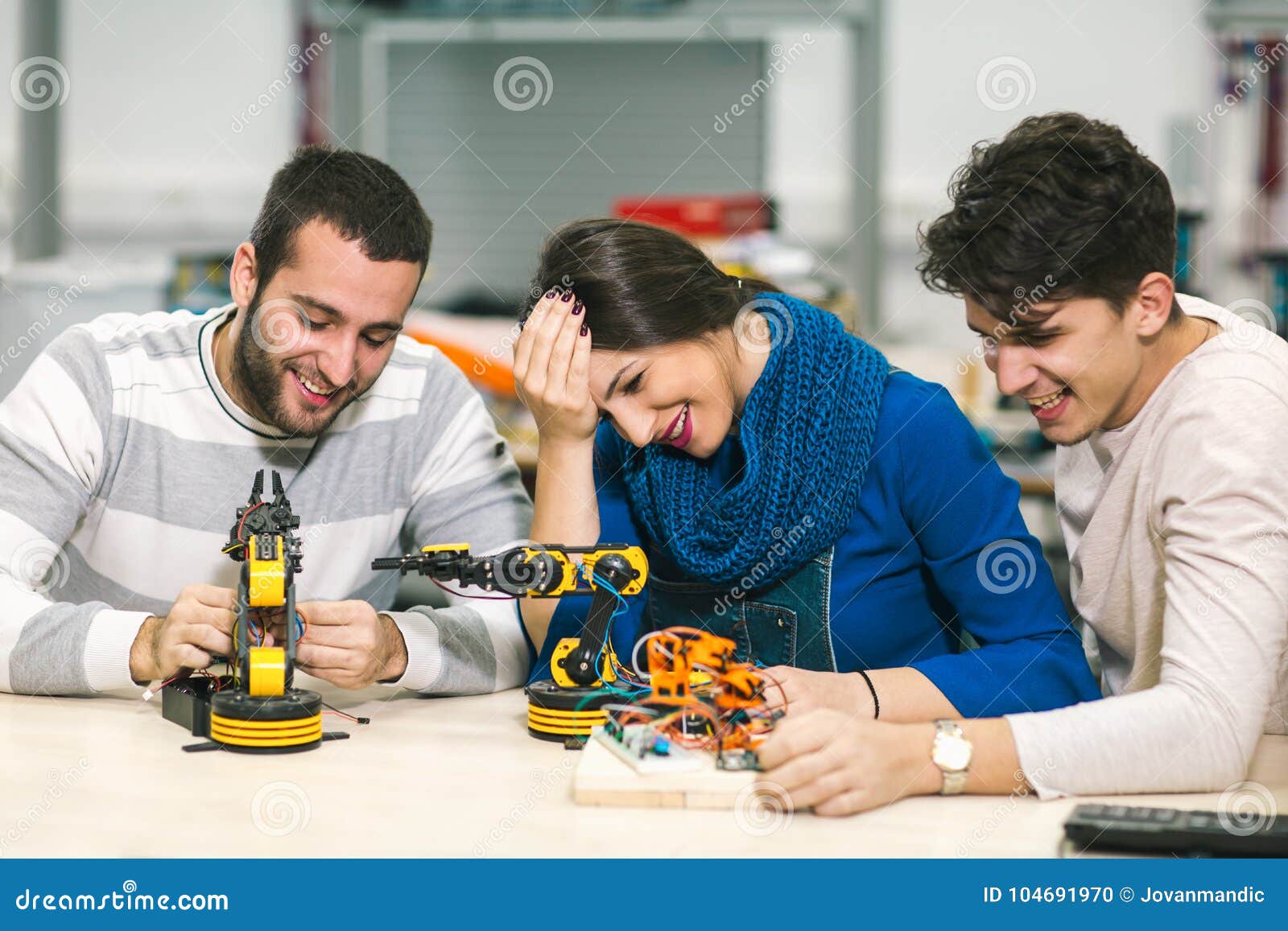 Young Students of Robotics Preparing Robot for Testing Stock Photo ... Young Students of Robotics Preparing Robot for Testing Stock Photo ...