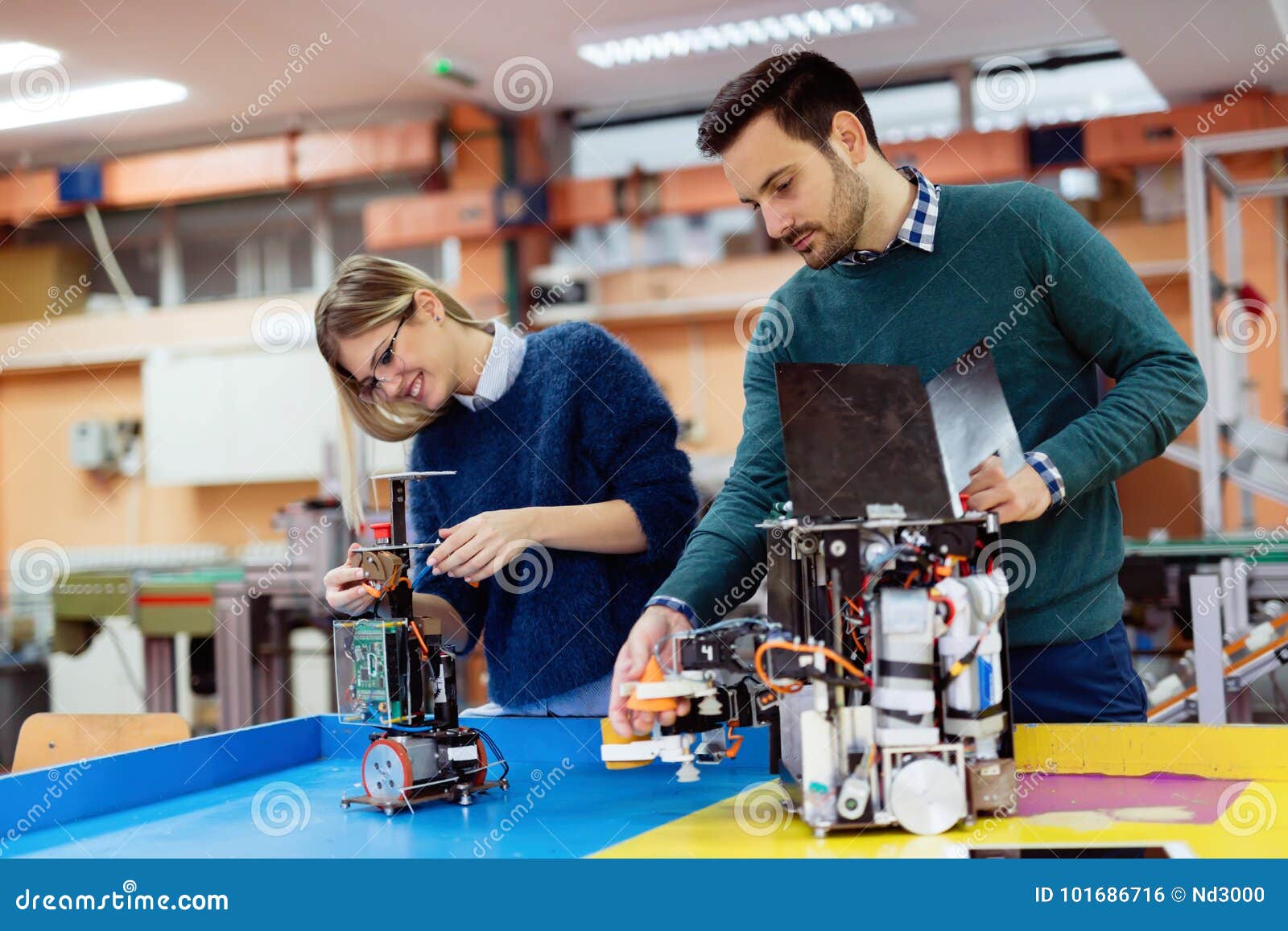 Young Students of Robotics Preparing Robot for Testing Stock Photo ...
