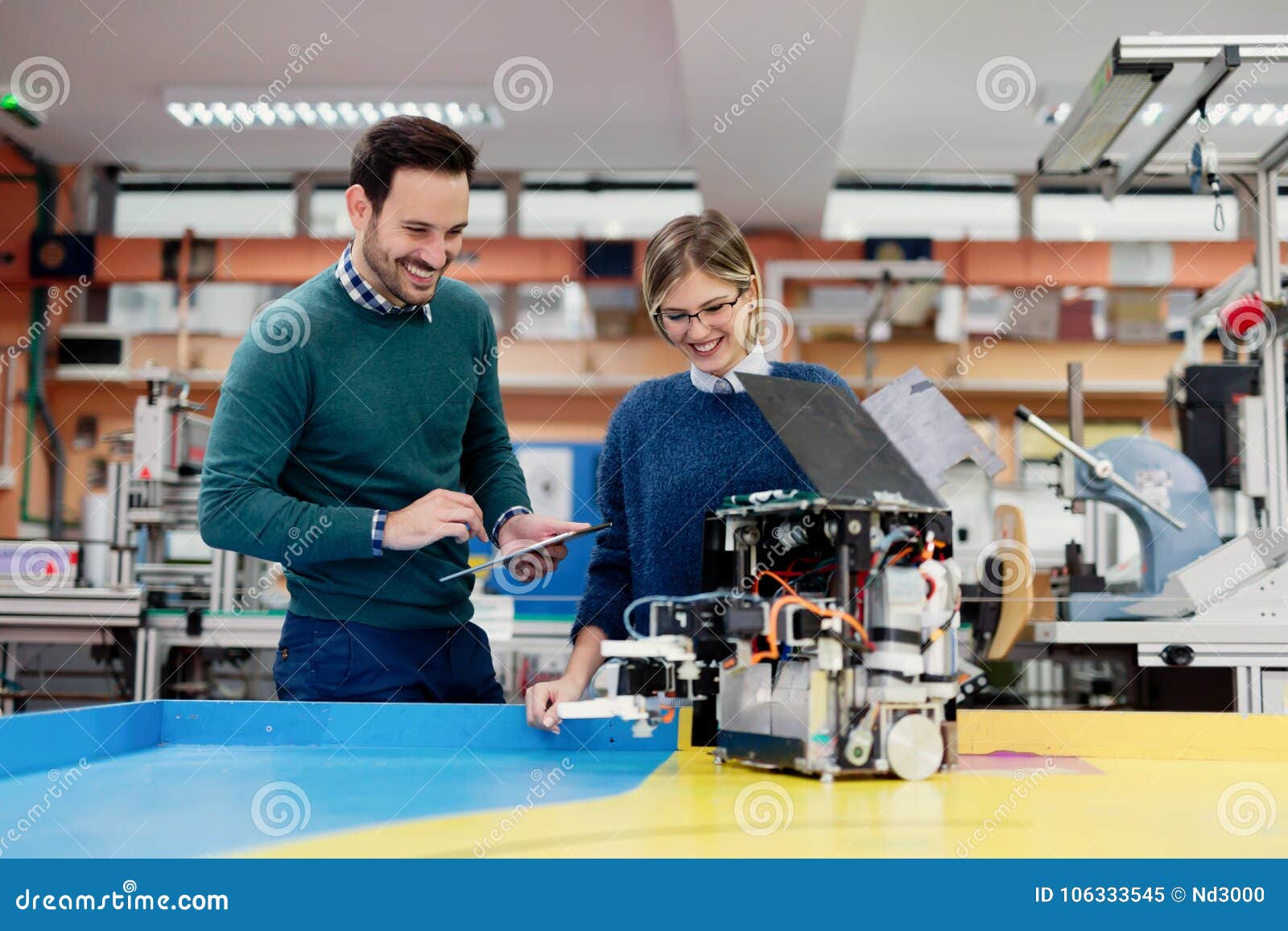 Young Students of Robotics Preparing Robot for Testing Stock Image ... Young Students of Robotics Preparing Robot for Testing Stock Image ...