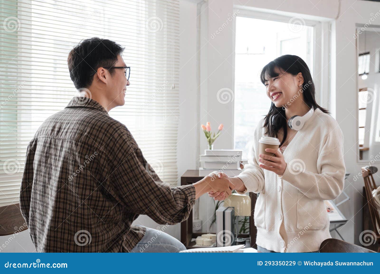 Young Students Sit in the Library Studying, Sharing Knowledge and ...