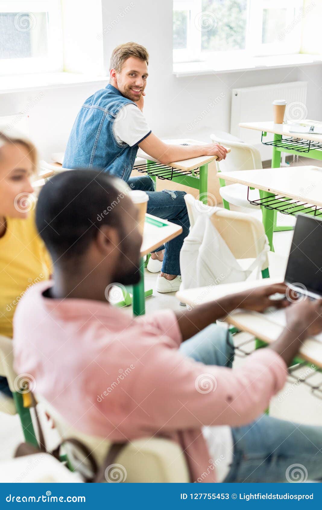 Young Students Sitting at Classroom Stock Image - Image of together ...