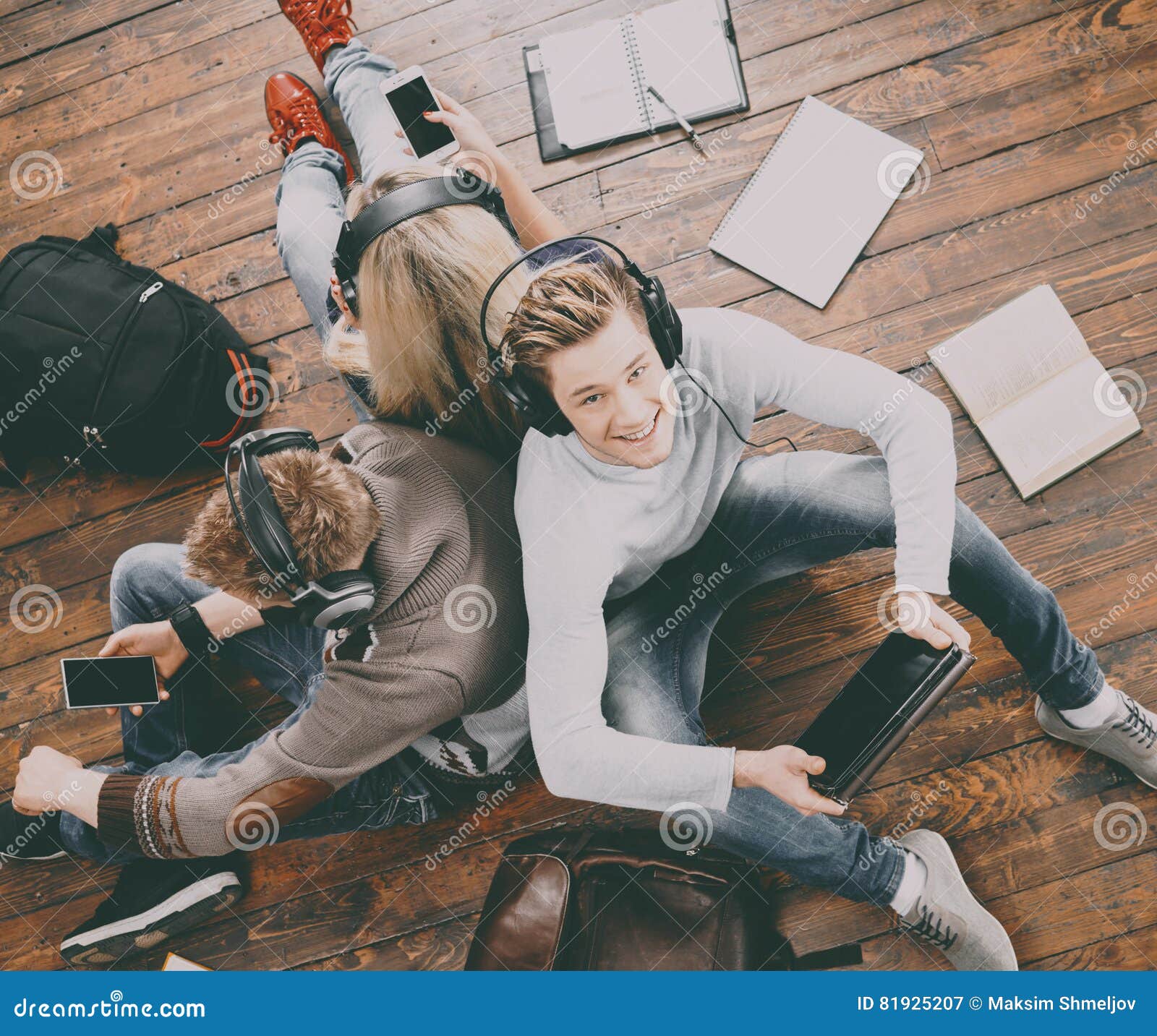 Young Students Sitting on the Floor and Studying Stock Image - Image of ...