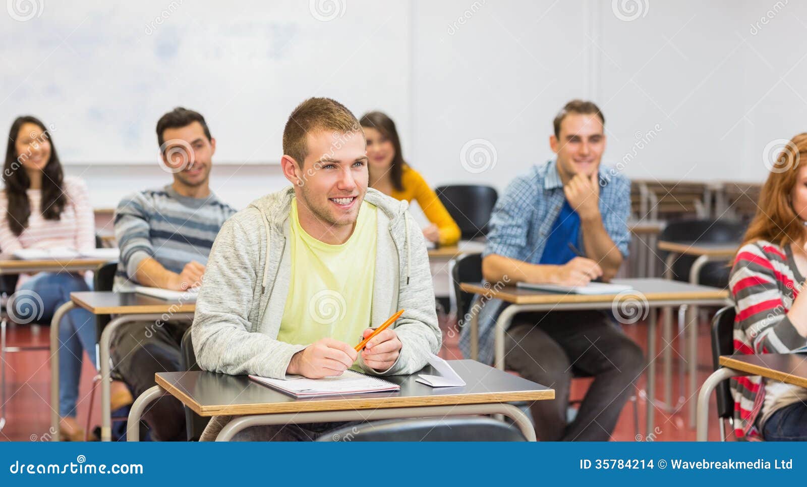 Young Students Smiling in Classroom Stock Photo - Image of knowledge ...