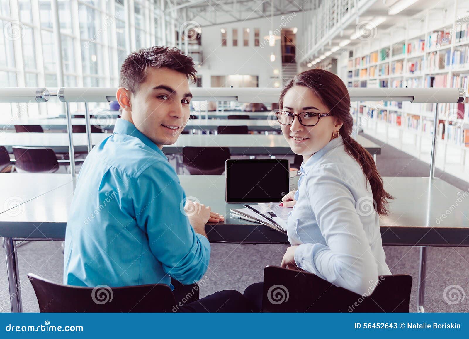 Young Students Studying with Tablet Pc in the Library Stock Image ...
