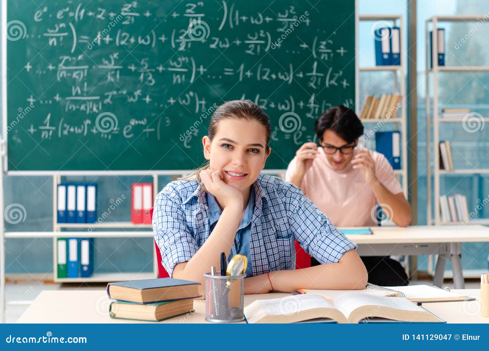 The Young Students Taking the Math Exam in Classroom Stock Image ...