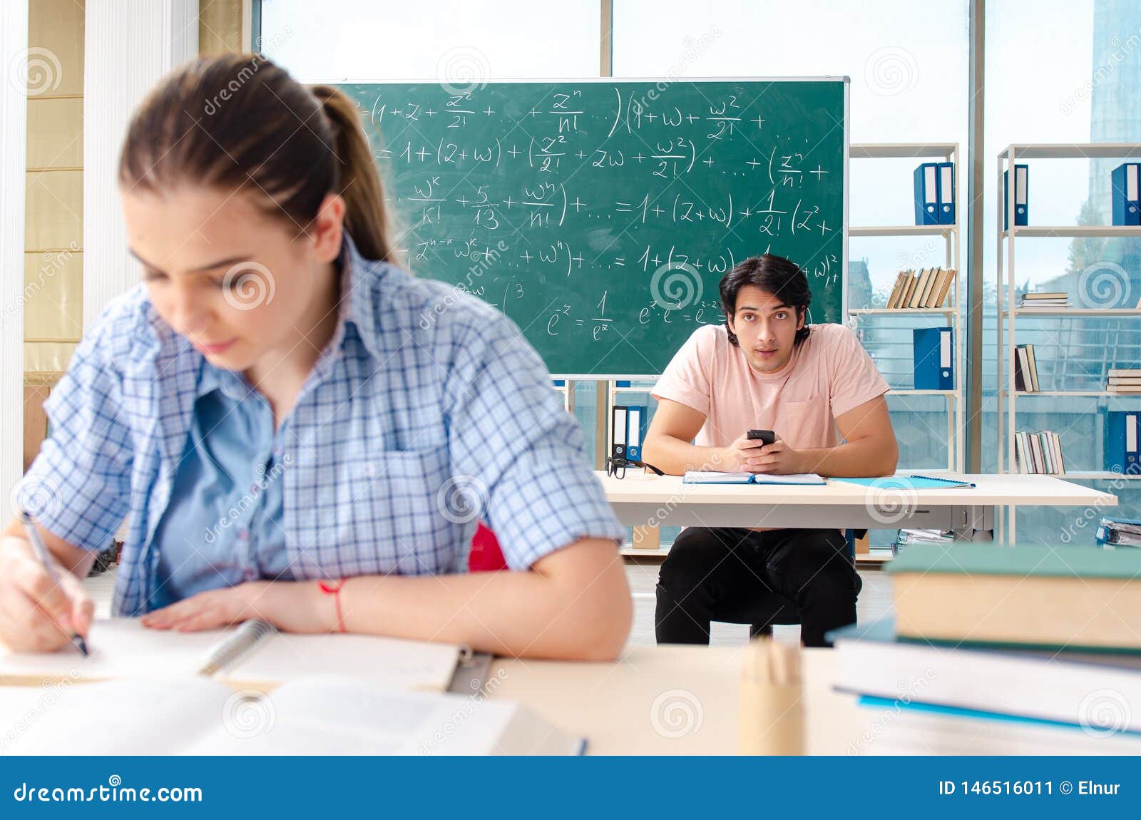 The Young Students Taking the Math Exam in Classroom Stock Image ...