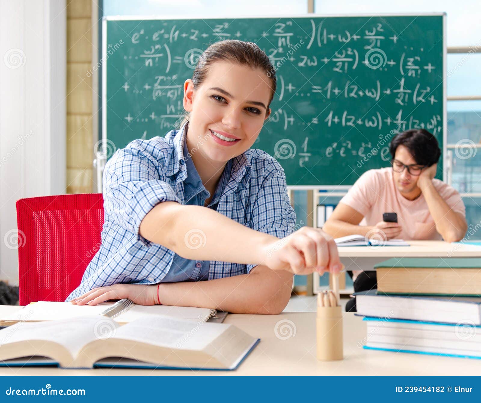 The Young Students Taking the Math Exam in Classroom Stock Photo ...
