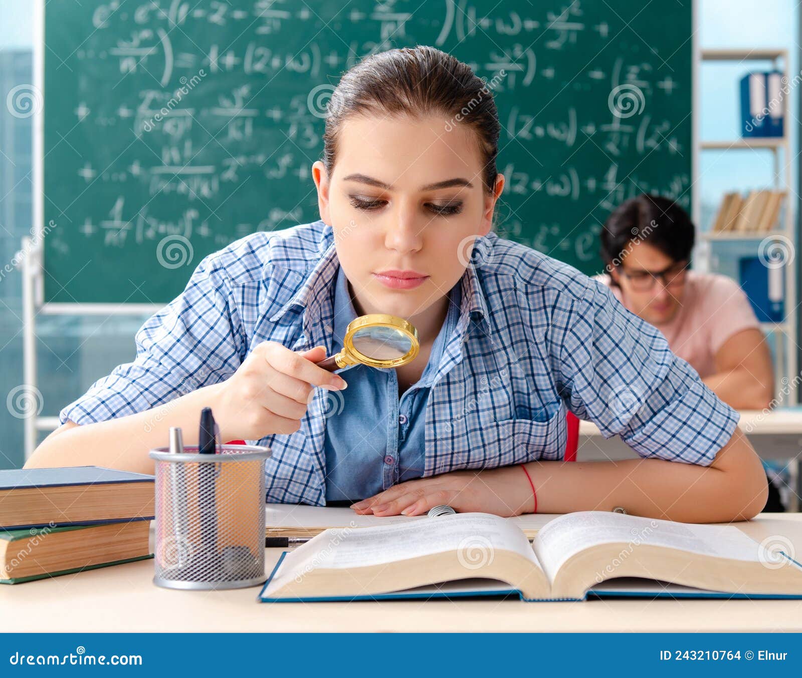 The Young Students Taking the Math Exam in Classroom Stock Photo ...