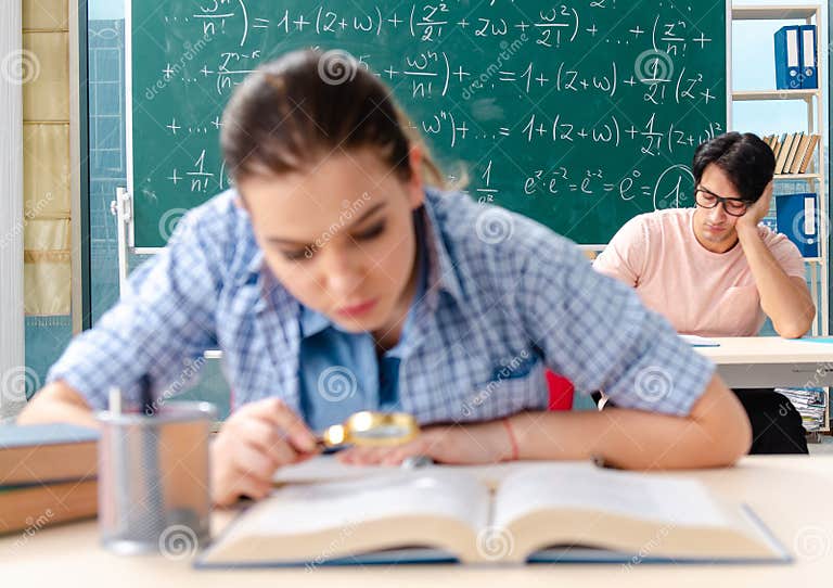 Young Students Taking the Math Exam in Classroom Stock Photo - Image of ...