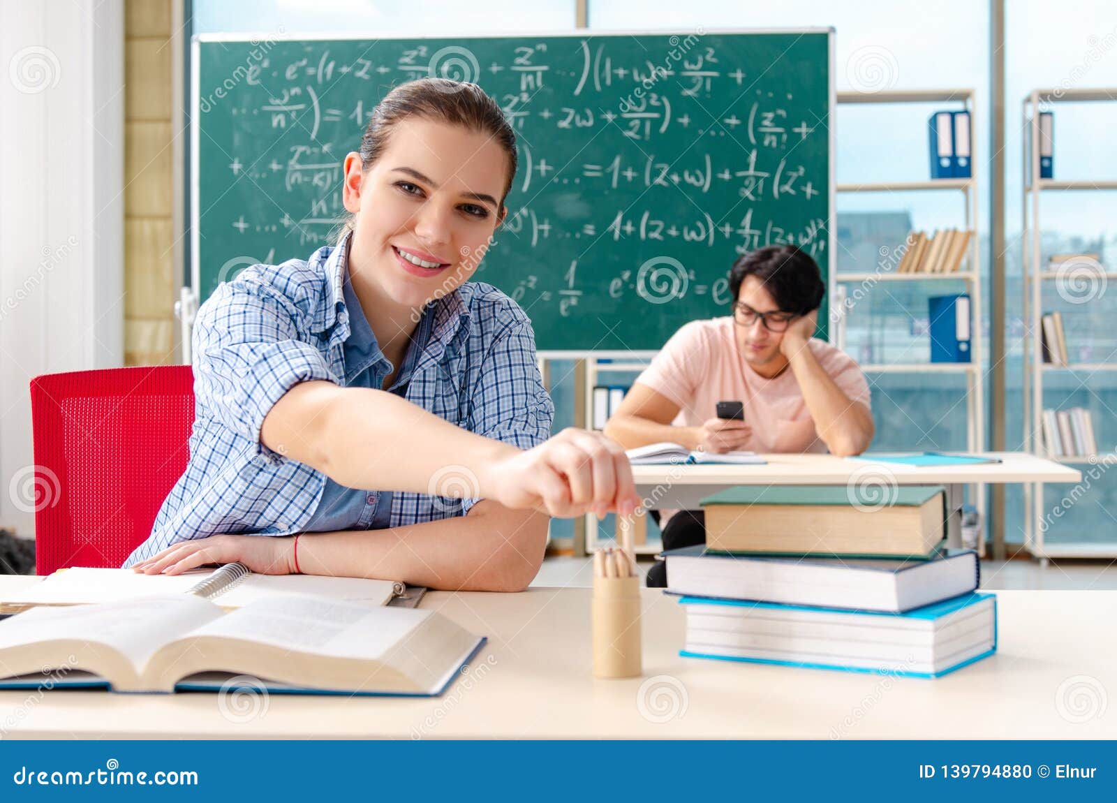 The Young Students Taking the Math Exam in Classroom Stock Photo ...