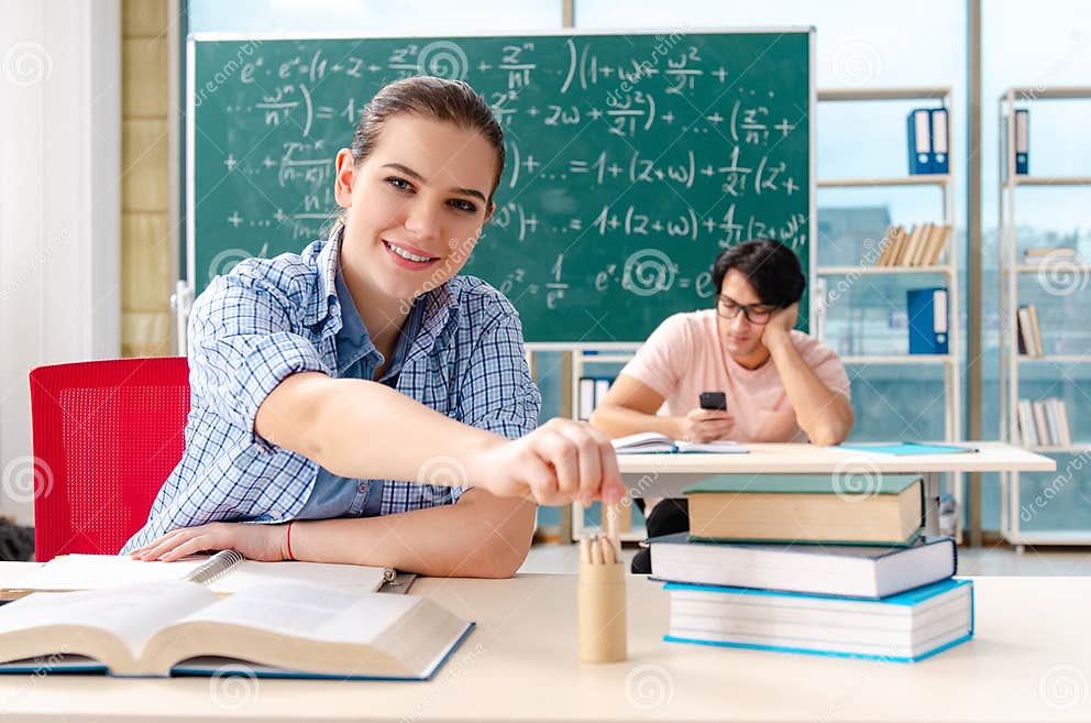 The Young Students Taking the Math Exam in Classroom Stock Photo ...