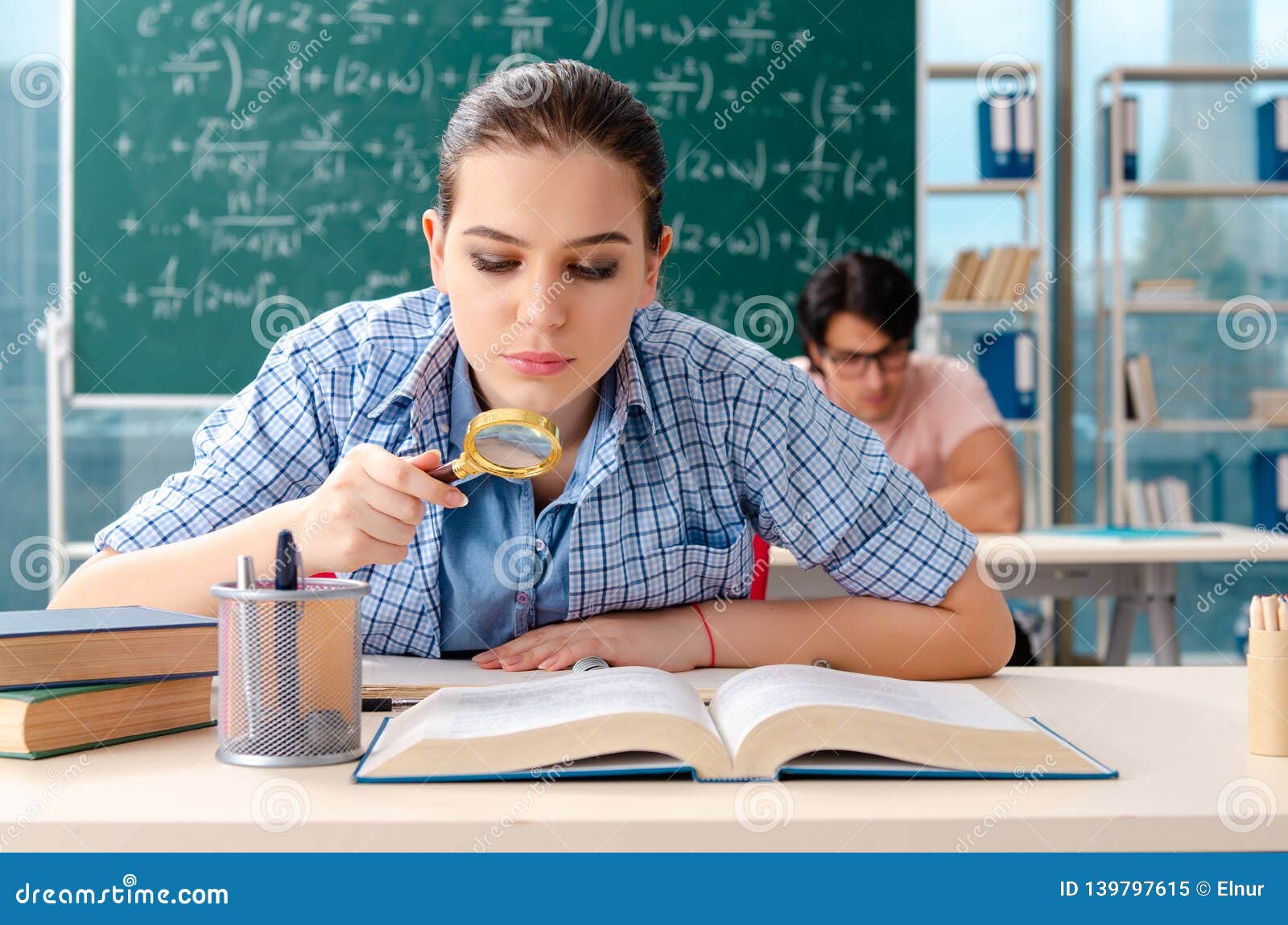 The Young Students Taking the Math Exam in Classroom Stock Image ...