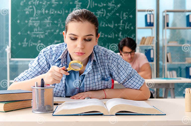 The Young Students Taking the Math Exam in Classroom Stock Image ...