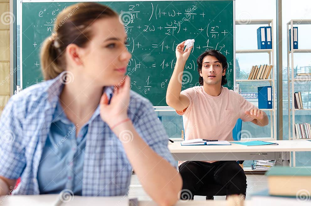 The Young Students Taking the Math Exam in Classroom Stock Image ...