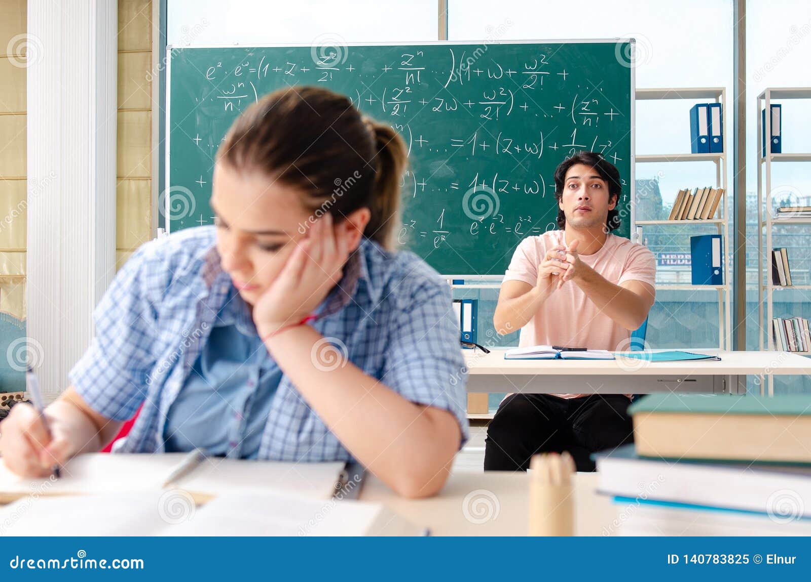The Young Students Taking the Math Exam in Classroom Stock Image ...