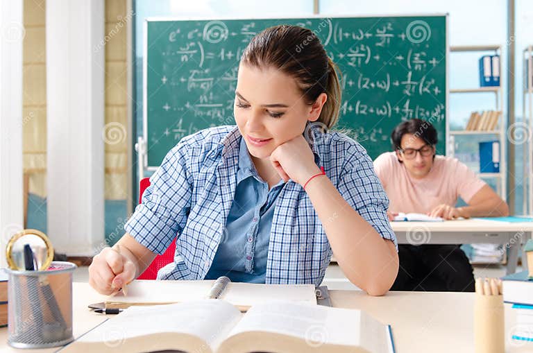 The Young Students Taking the Math Exam in Classroom Stock Photo ...