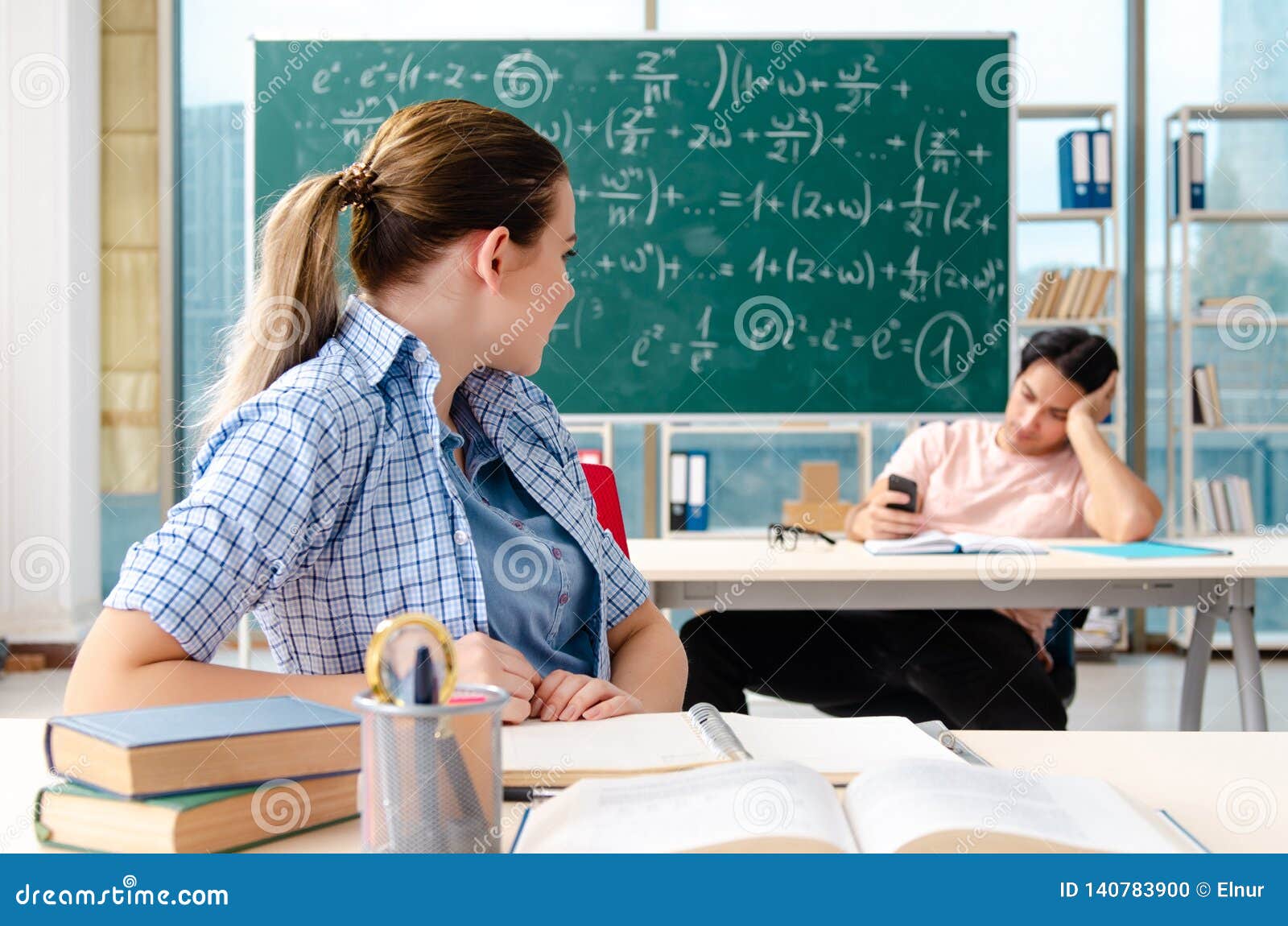 The Young Students Taking the Math Exam in Classroom Stock Photo ...