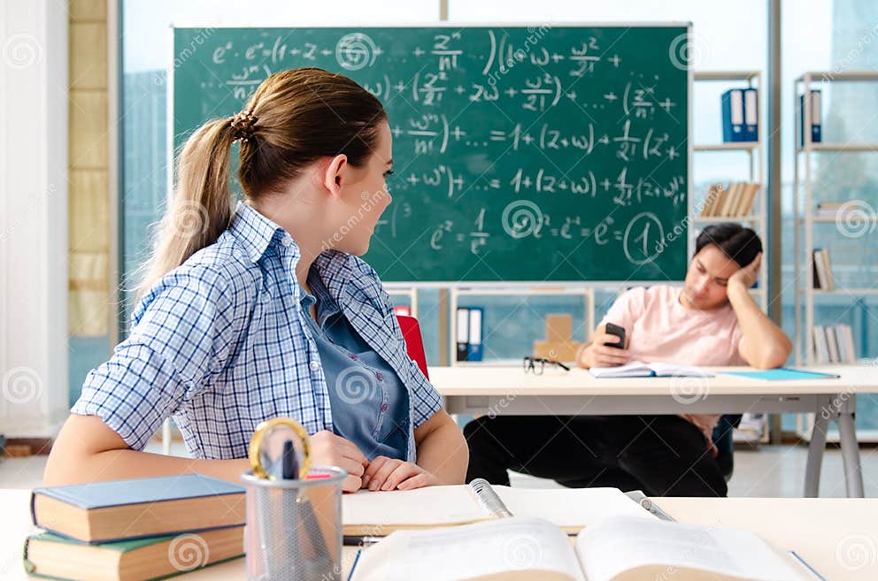The Young Students Taking the Math Exam in Classroom Stock Photo ...