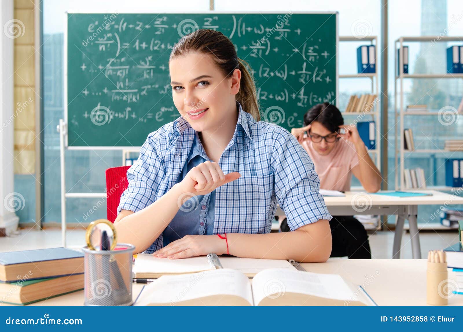 The Young Students Taking the Math Exam in Classroom Stock Photo ...