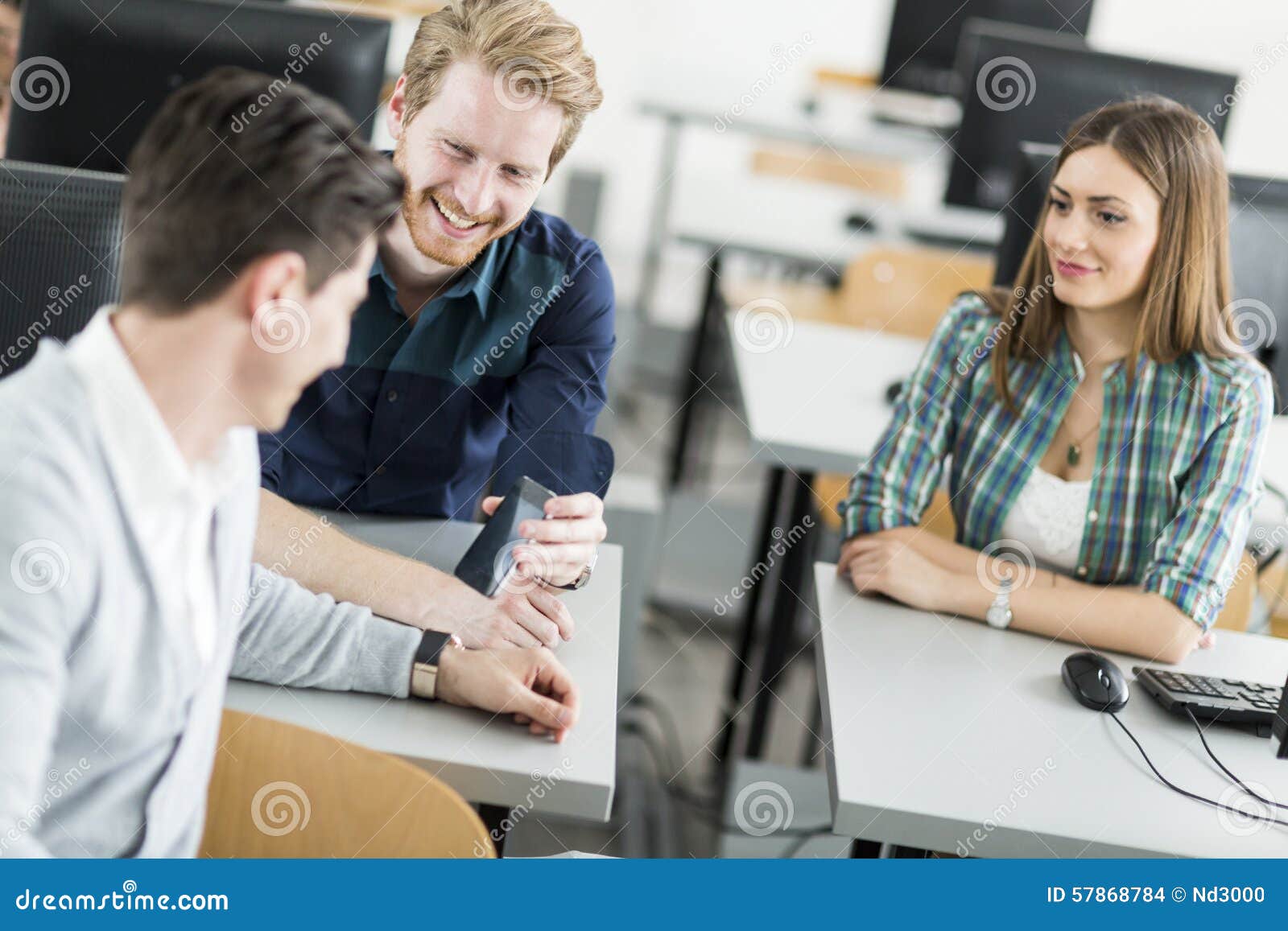 Young Students Talking in a Classroom Stock Photo - Image of ...