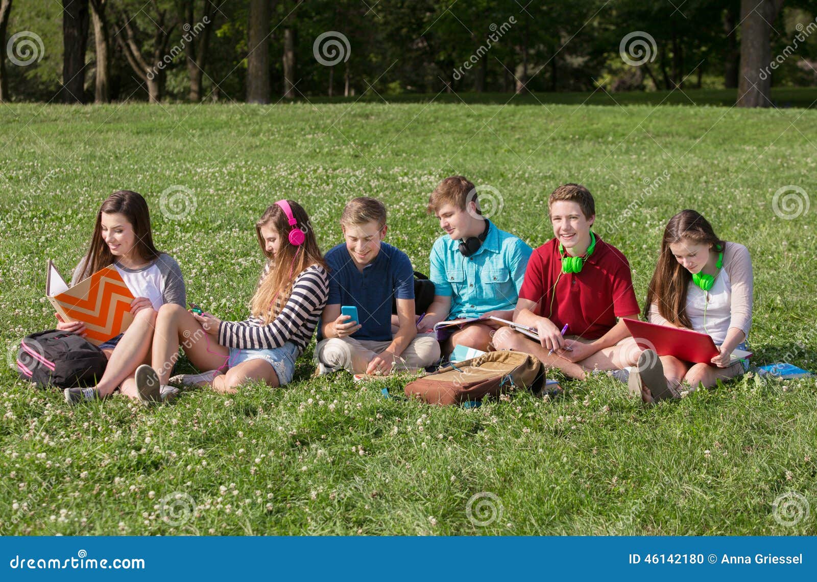 Young Students with Technology Stock Photo - Image of student, lawn ...