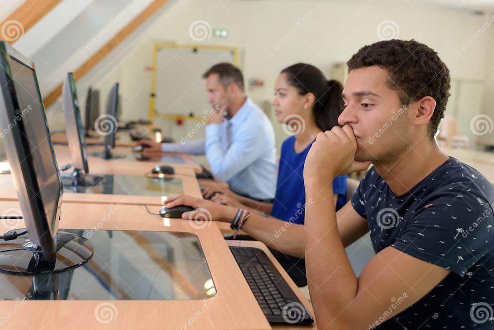 Young Students Working with Computer Stock Photo - Image of adult ...