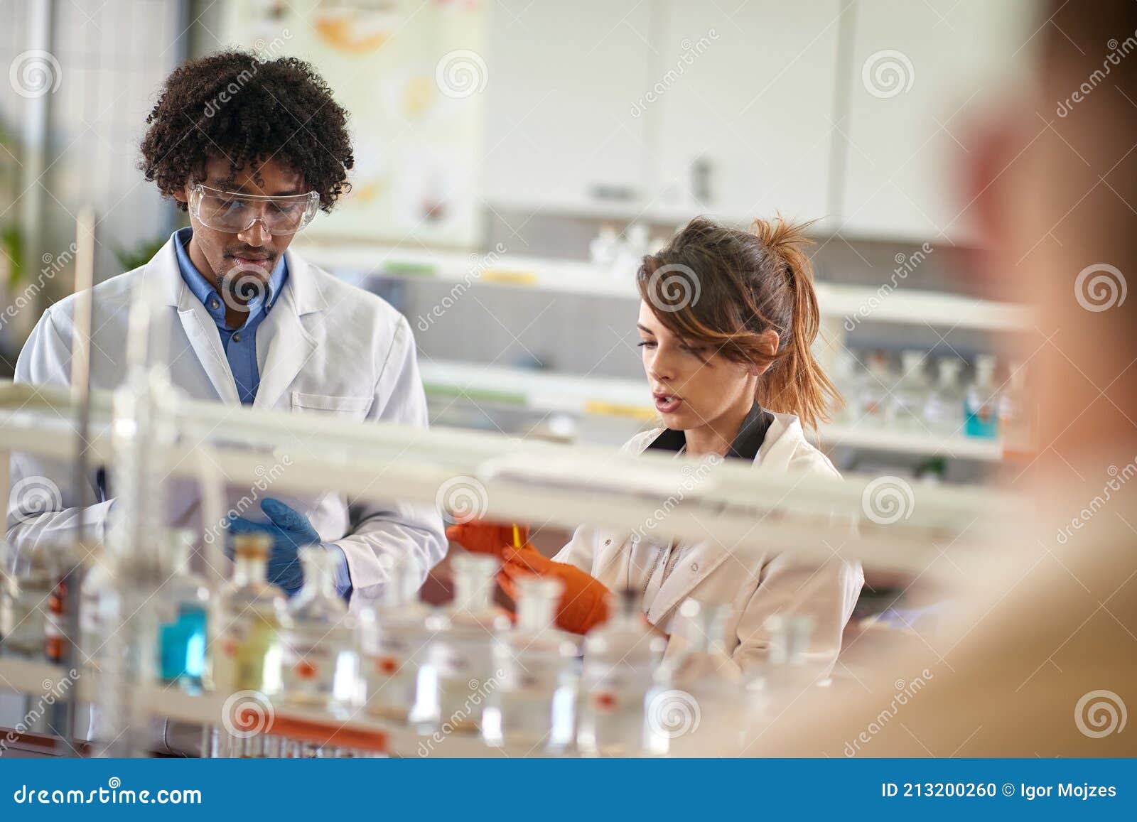 Young Students Working Together with Chemicals in the Laboratory ...