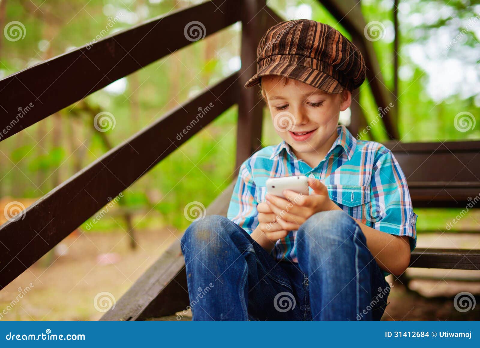 Young Boy Browsing Mobile Internet on Phone Stock Photo - Image of ...