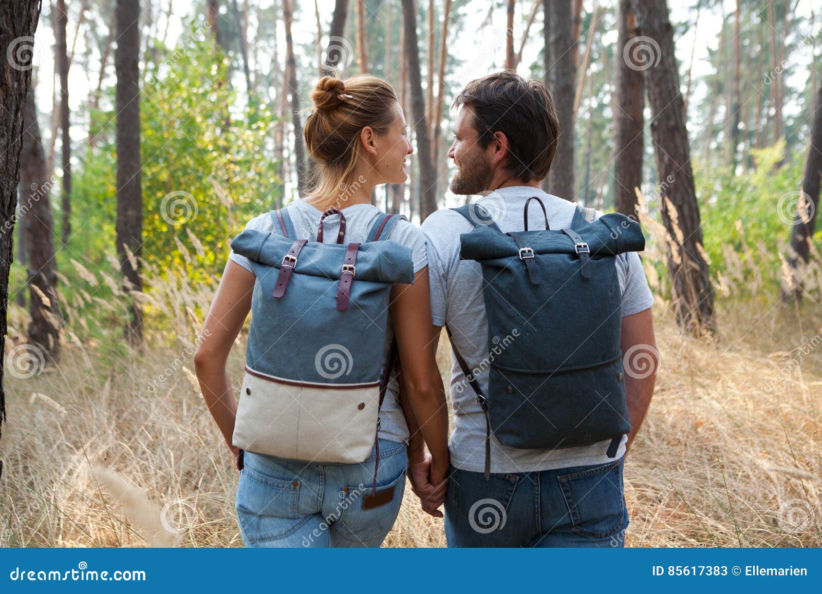 Young Stylish Couple with Backpacks Hugging in Forest Stock Image ...