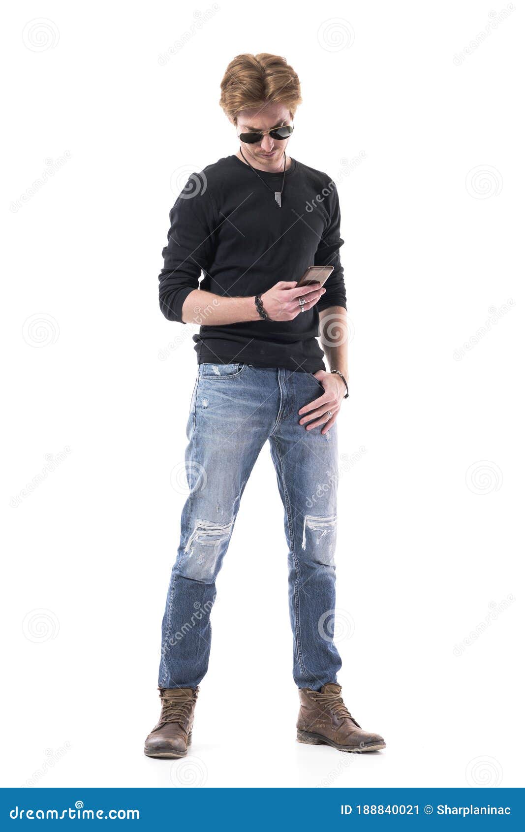 Young Stylish Ginger Man Standing and Looking Down Using Cell Phone ...