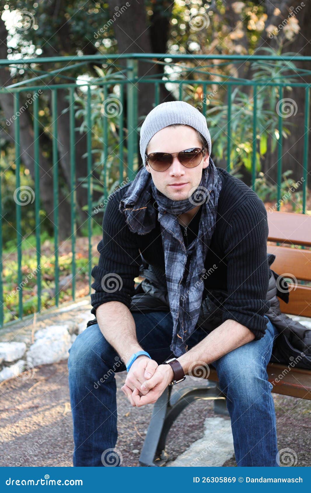 Young Stylish Man Sitting on a Bench Stock Image - Image of looking ...