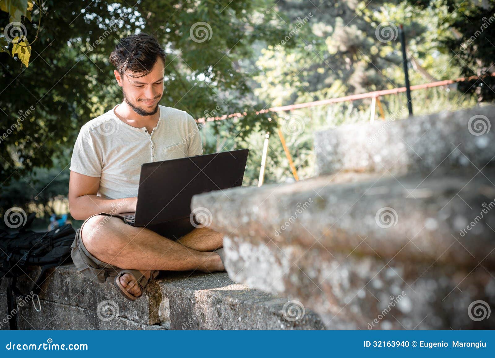 Young Stylish Man Using Notebook Stock Photo - Image of street, years ...