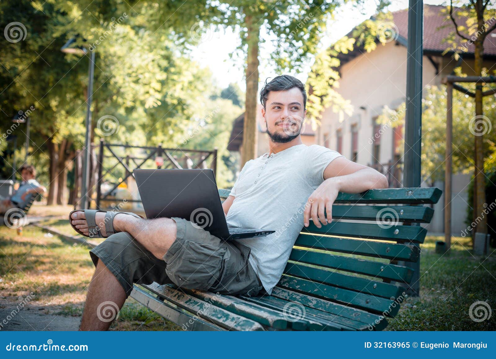 Young Stylish Man Using Notebook Stock Image - Image of ground ...