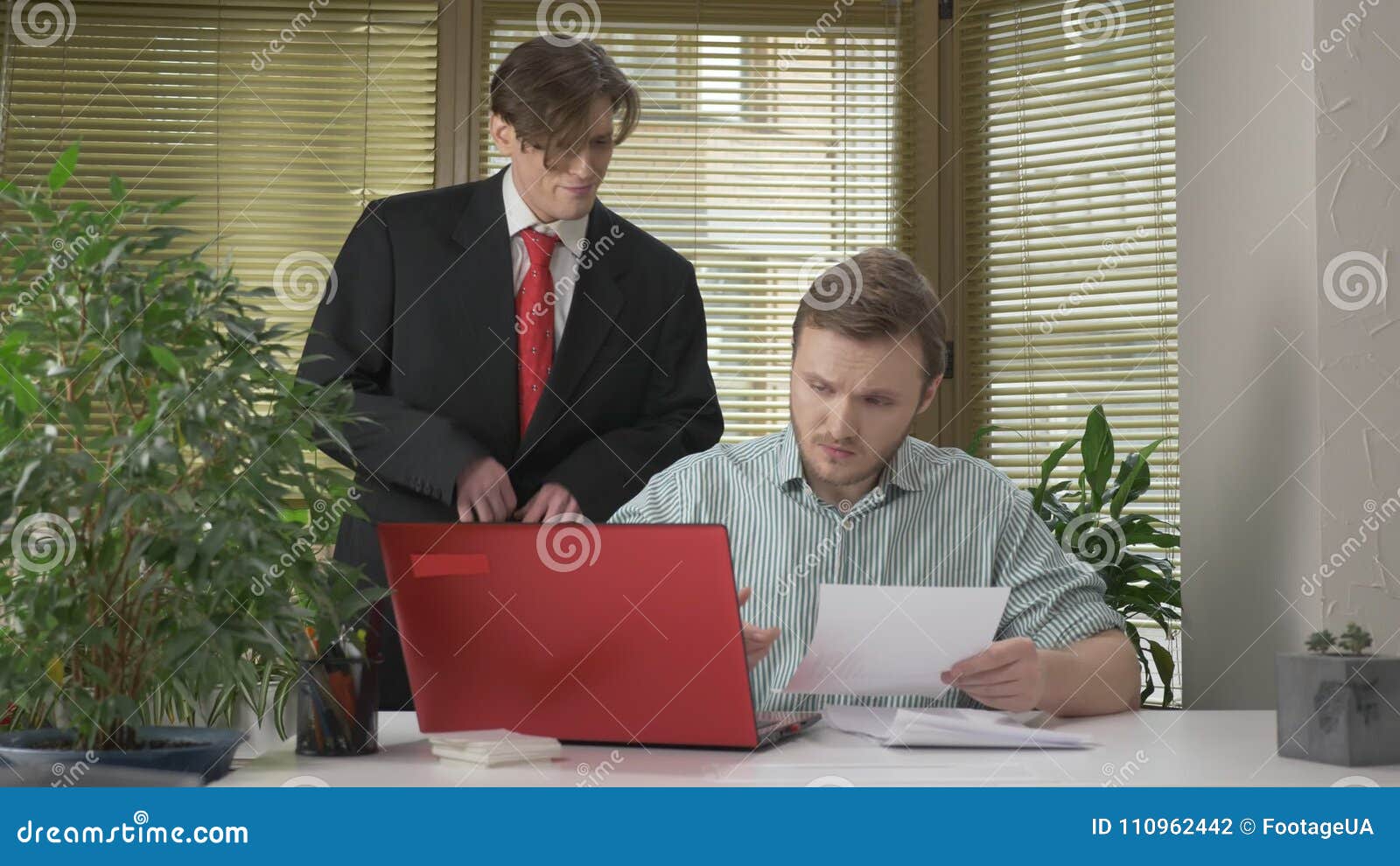 A Young Subordinate Employee Brought the Boss a Report, a Document ...