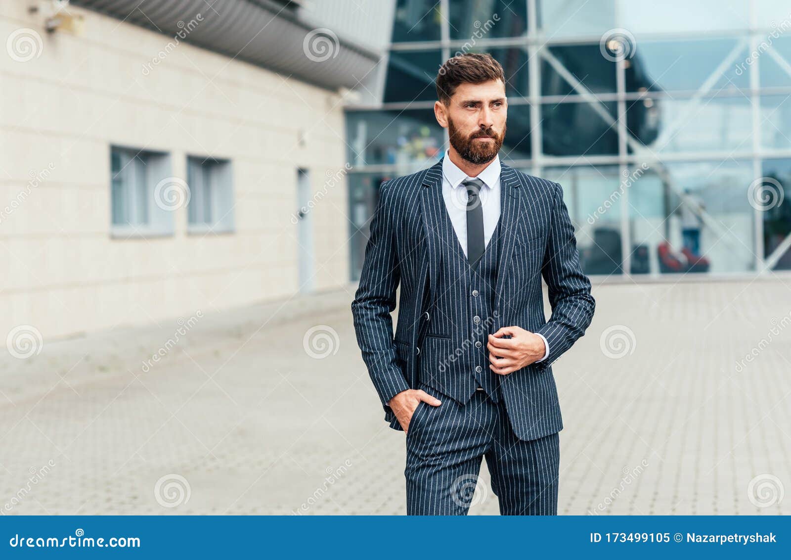 Young and Successful. Handsome Young Man in Full Suit Adjusting His ...