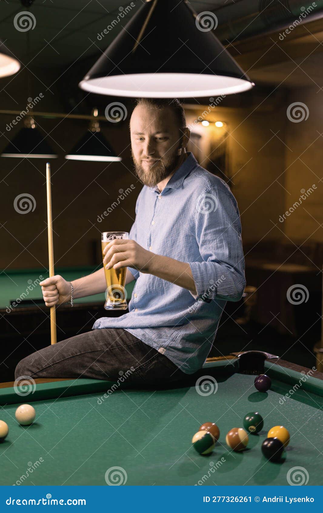 Young Successful Handsome Man Playing in Pool at Bar Drinking Beer ...