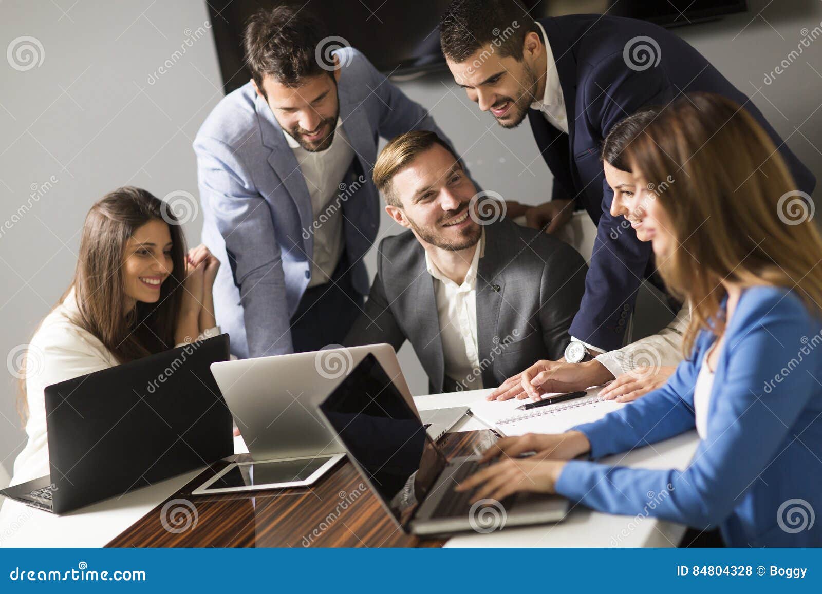 Young Successful Managers Discussing New Business Project Stock Photo ...