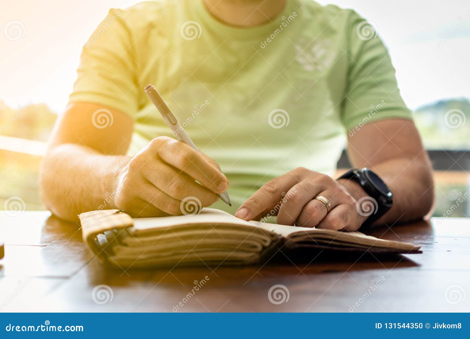 A Young Successful Person Taking Notes in a Personal Journal Stock ...
